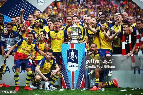 Arsenal Players Celebrate With The Trophy After The Fa Cup Final