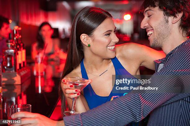 Young Couple Kissing In Nightclub Photos And Premium High Res Pictures