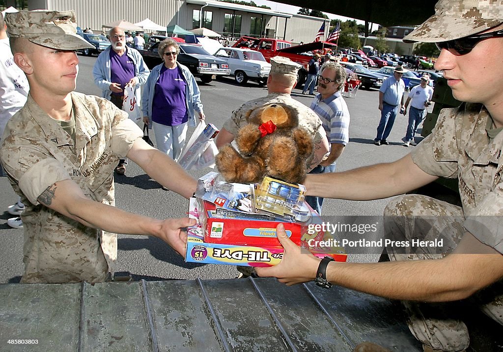 U S Marine Corps Lance Cpl Dave Howard Left Hands Donated Toys
