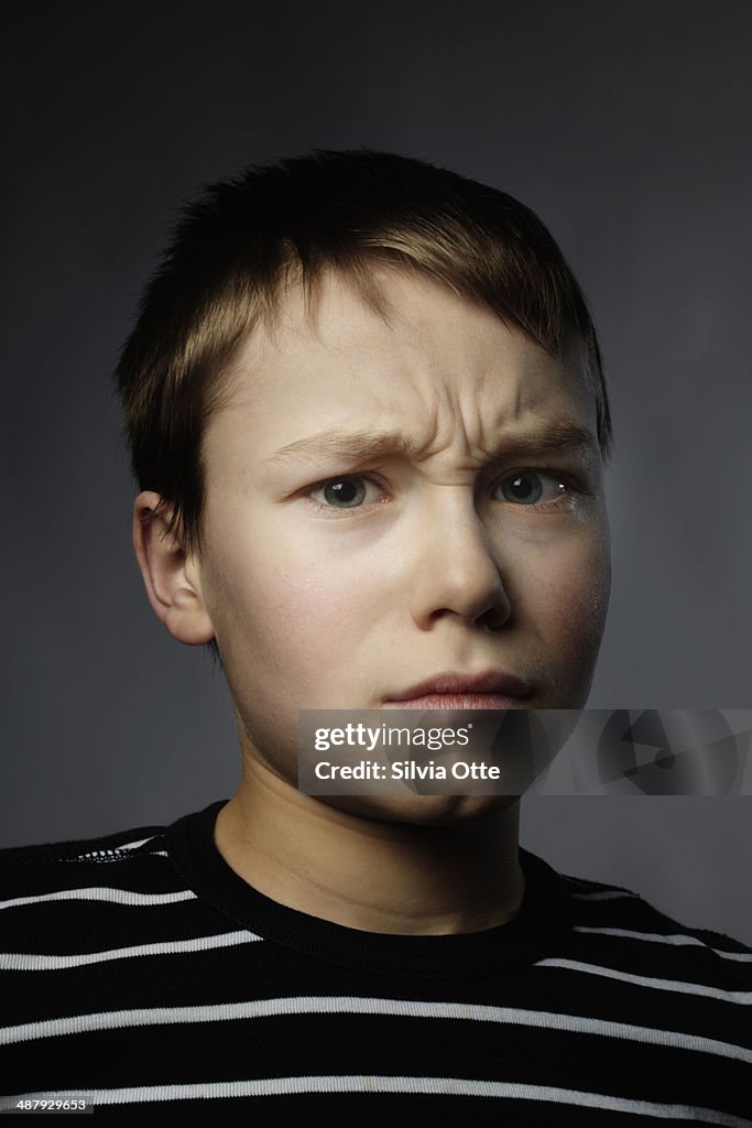 Portrait Of Young Boy With Suspicious Expression High-Res Stock Photo ... Portrait Of Young Boy With Suspicious Expression High-Res Stock Photo ...