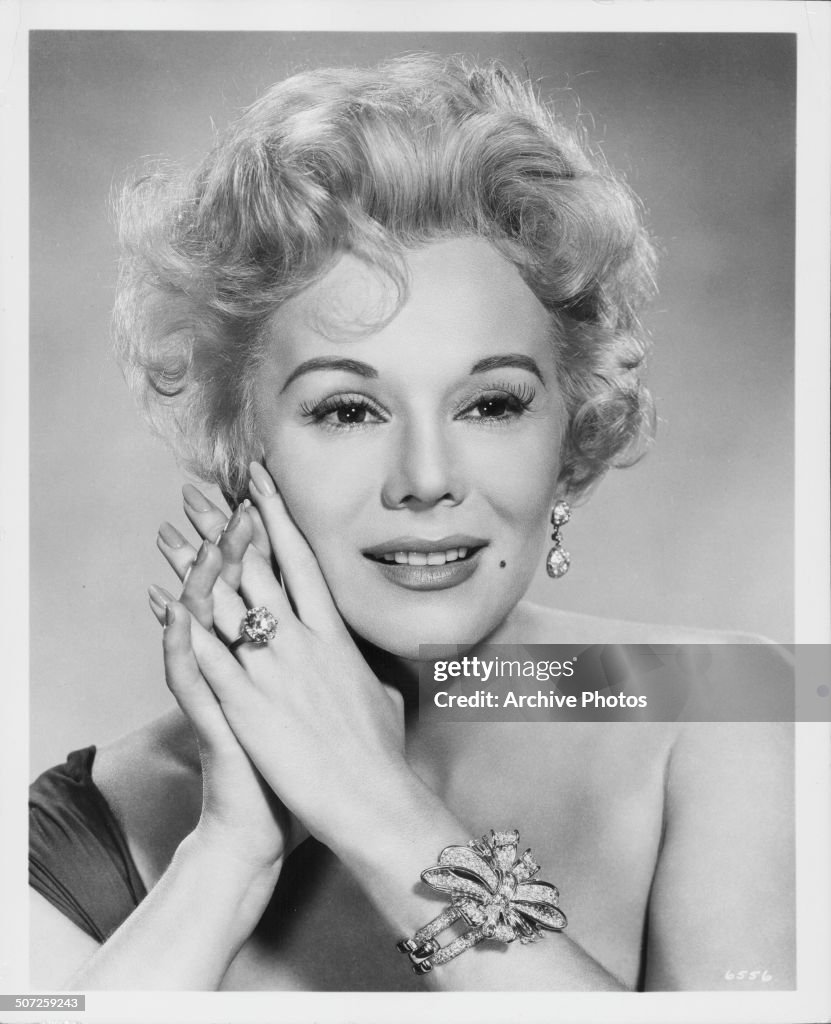 Headshot Of Actress And Socialite Eva Gabor With Her Hands To Her