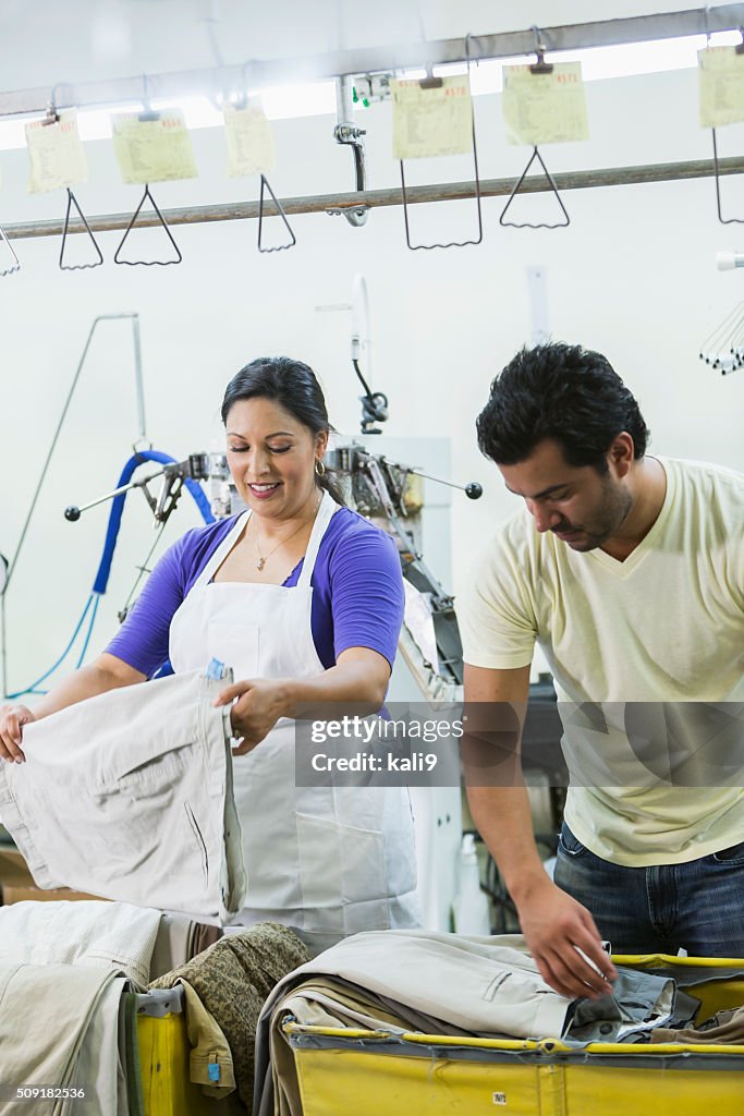 Hispanic Couple Working In Dry Cleaner High-Res Stock Photo - Getty Images Hispanic Couple Working In Dry Cleaner High-Res Stock Photo - Getty Images