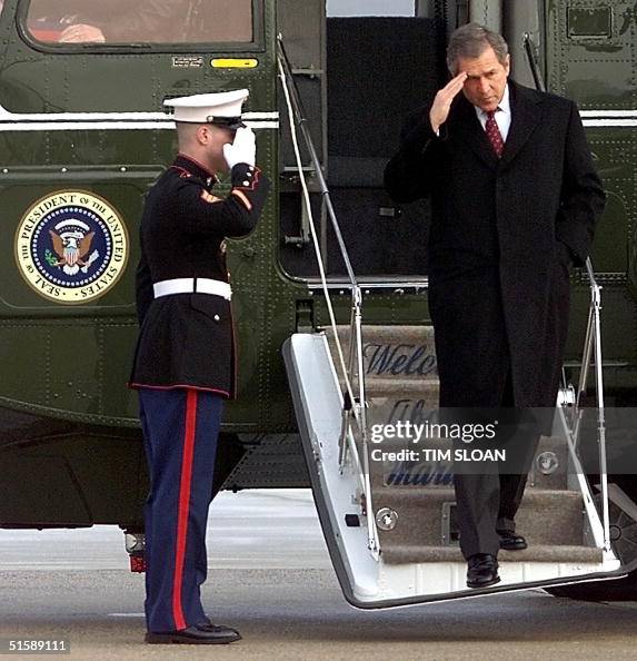 Us President George W Bush Salutes His Marine Guard As He Leaves