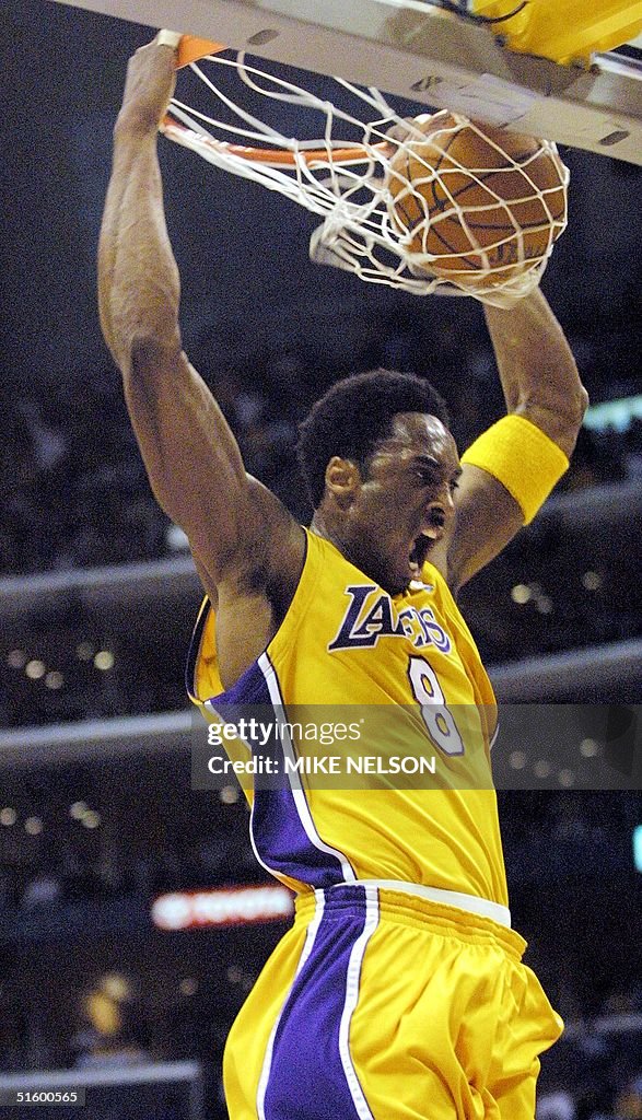 Kobe Bryant Of The Los Angeles Lakers Dunks The Ball Against The