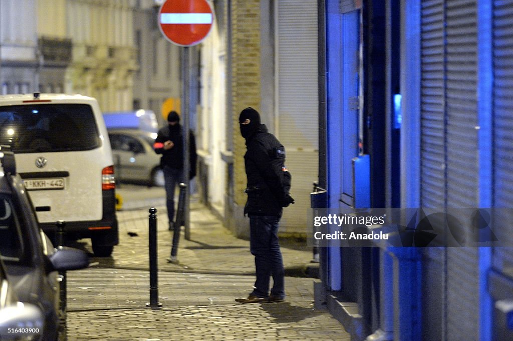 Police Officers Stand Guard On The Street After A Raid That Paris