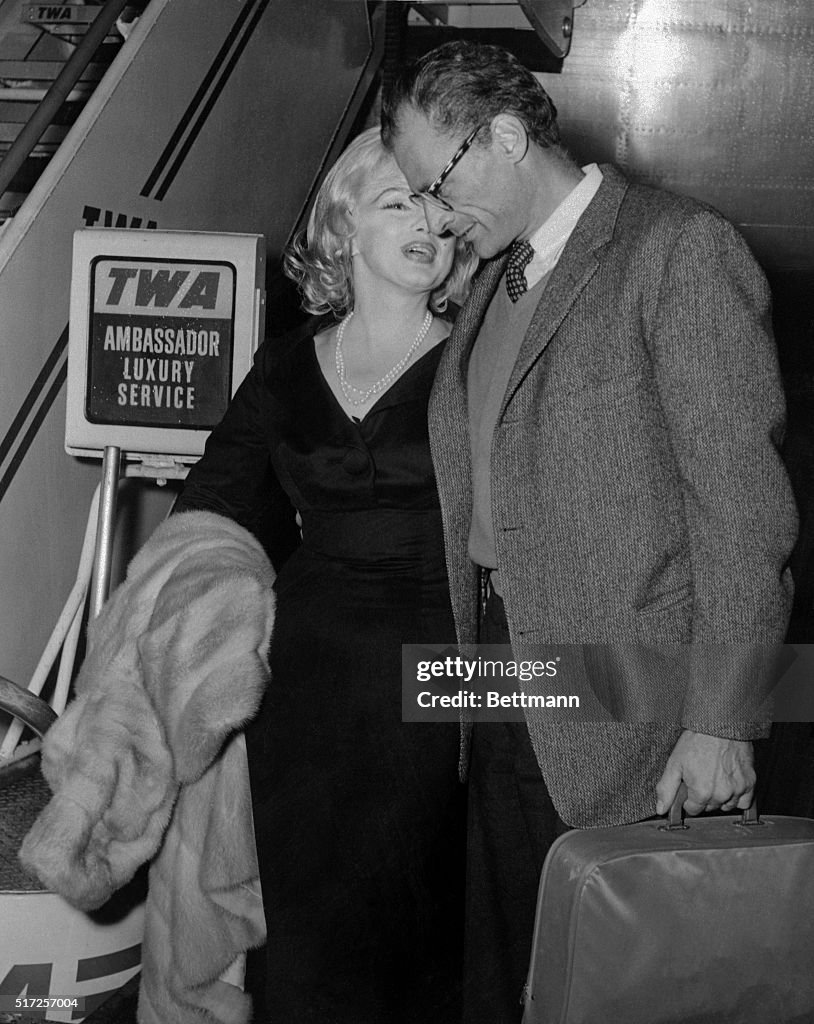 Actress Marilyn Monroe Whispers To Her Playwright Husband Arthur