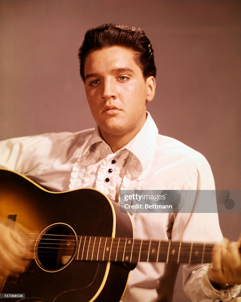 Elvis Presley In A Ruffled Dress Shirt And Playing The Guitar Waist News Photo Getty Images