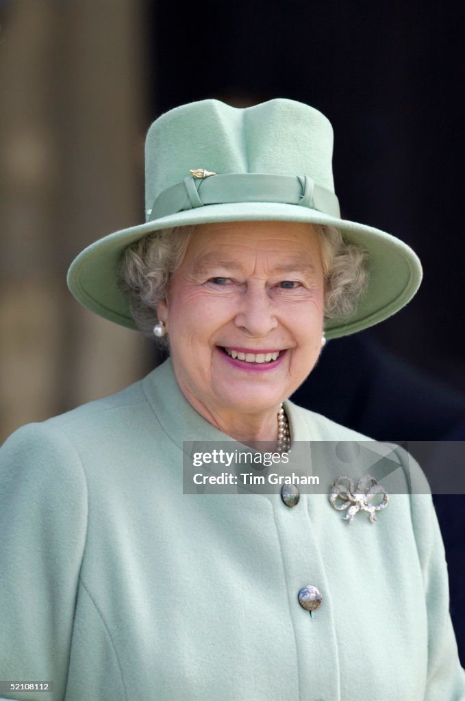 A Smiling Portrait Of Queen Elizabeth Ii Continuing Her Tour Of The