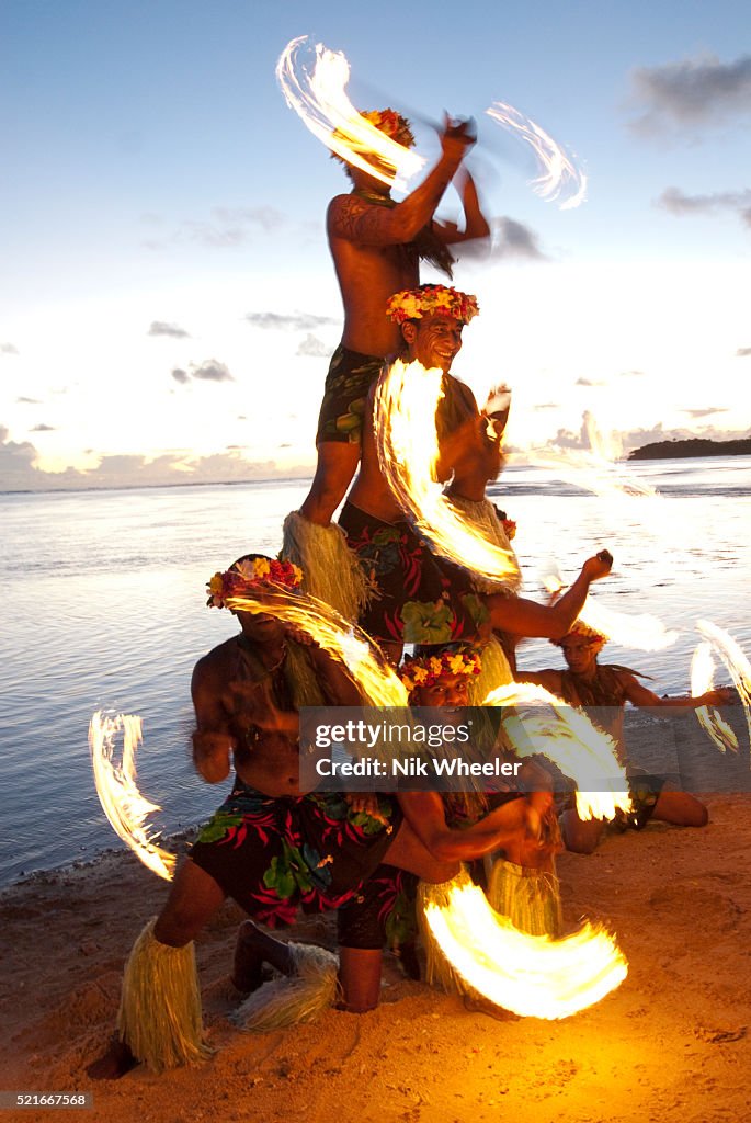 Polynesian Fire Dancers Twirl Fiery Torches During Display Of Fire