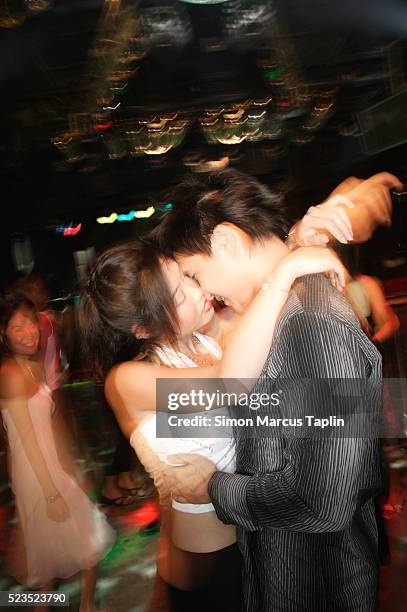 Couple Kissing Nightclub Photos And Premium High Res Pictures Getty