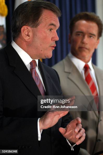 California Governor Arnold Schwarzenegger Listens While Secretary Of