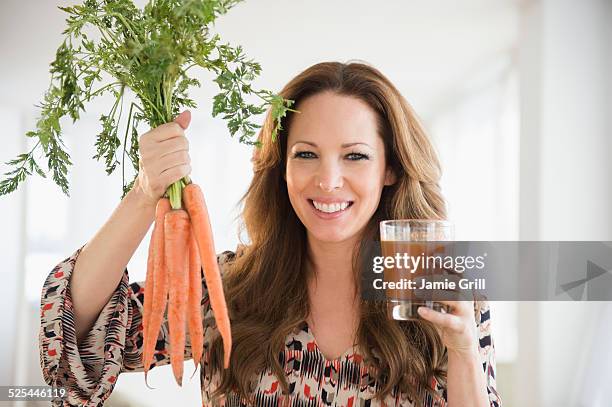 Mature Woman Carrot Juice Photos And Premium High Res Pictures Getty