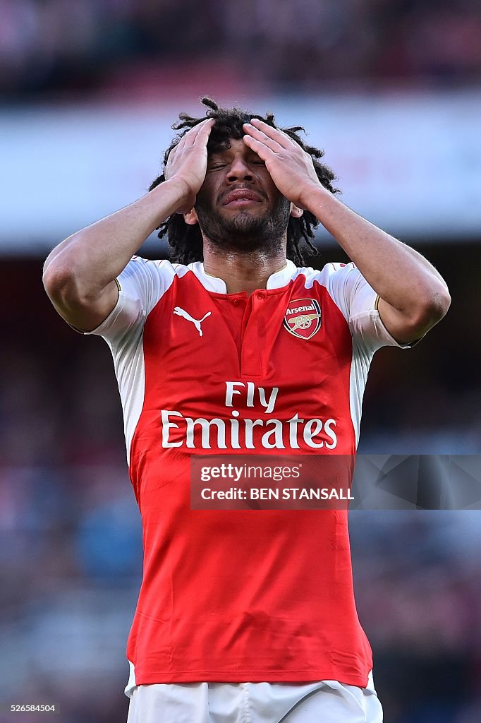 Arsenals Egyptian Midfielder Mohamed Elneny Reacts After Missing A