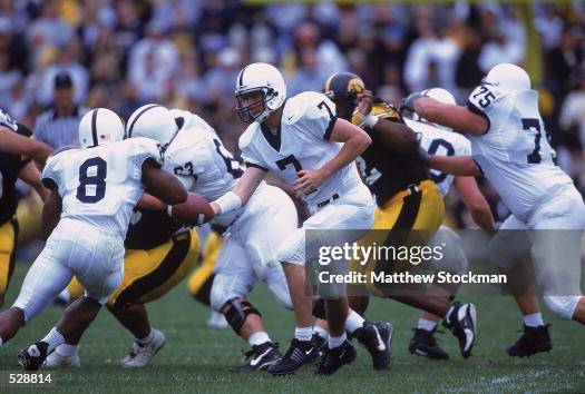 Zack Mills Of The Pennsylvania State Nittany Lions Hands Off The Ball