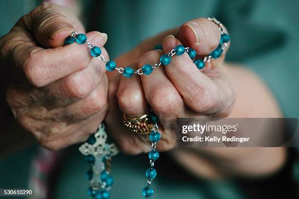 Rosary Beads In Hand High-Res Stock Photo - Getty Images Rosary Beads In Hand High-Res Stock Photo - Getty Images