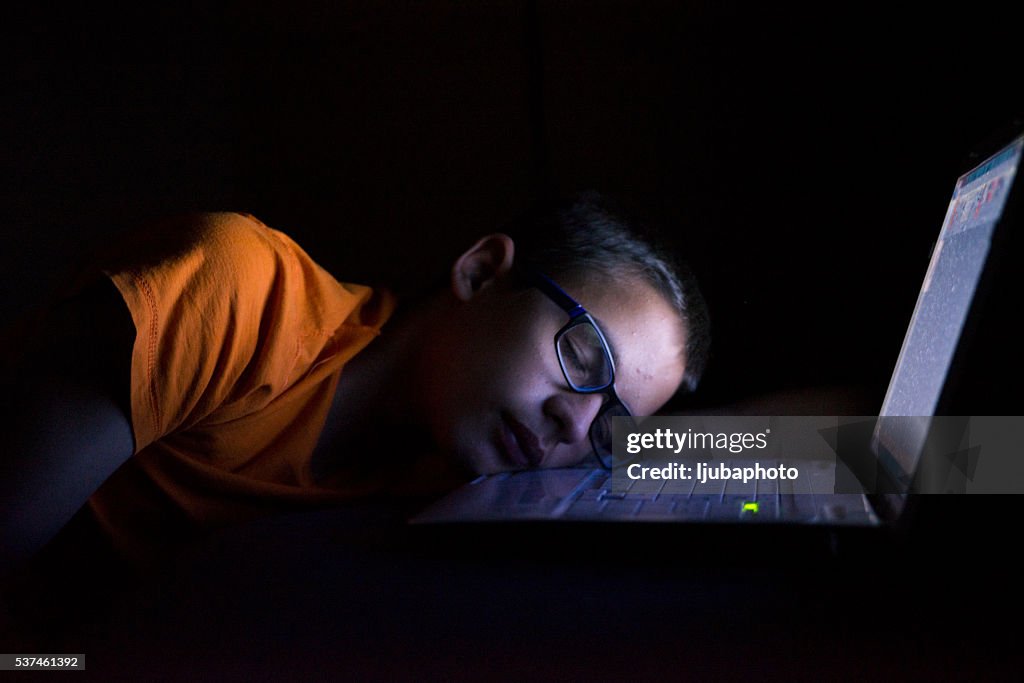 Young Teen Sleeping Front Of A Laptop Computer High-Res Stock Photo ... Young Teen Sleeping Front Of A Laptop Computer High-Res Stock Photo ...