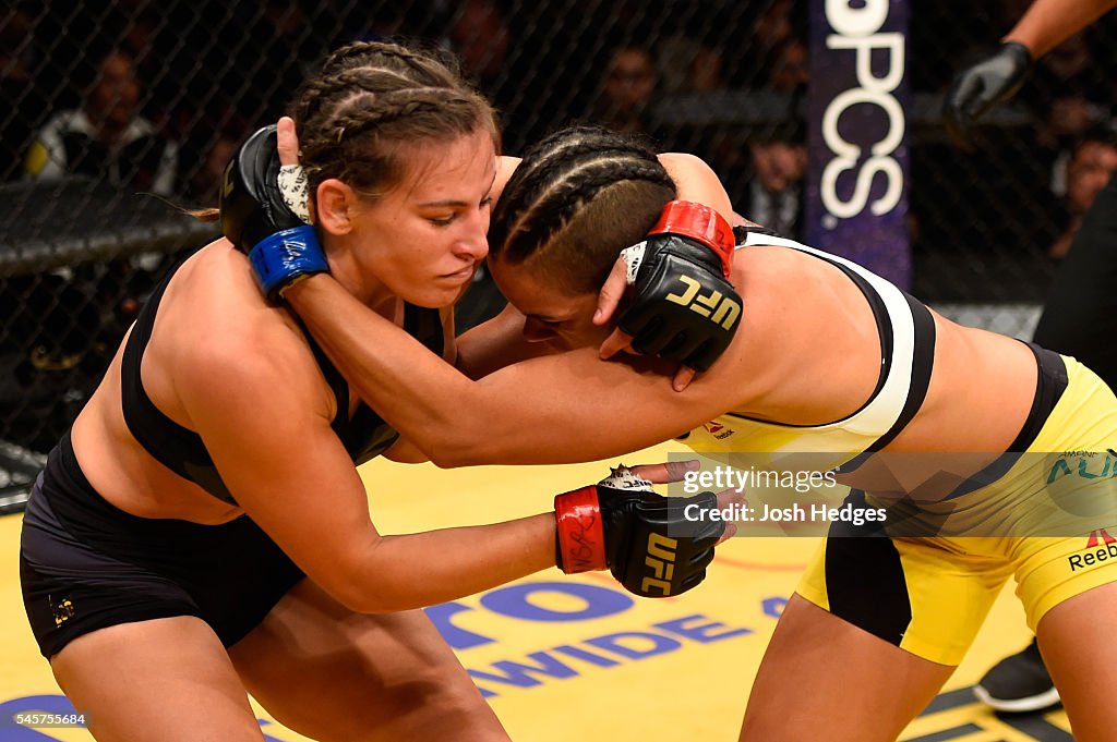 Miesha Tate Grapples With Amanda Nunes Of Brazil In Their Ufc Womens