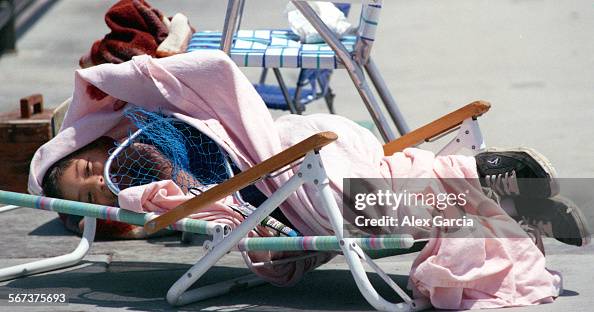 ME.beach.blanket.0525.UN Huddled under a blanket, David Avila of ... ME.beach.blanket.0525.UN Huddled under a blanket, David Avila of ...