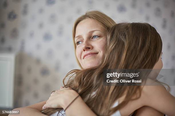 Smiling Mother And Daughter Hugging Photo Getty Images