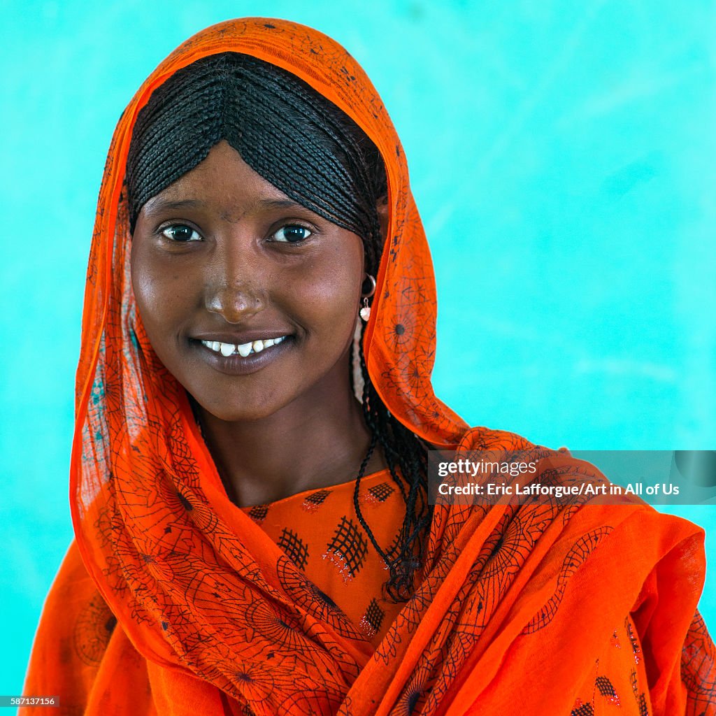 Portrait Of An Afar Tribe Girl With Braided Hair And Sharpened Teeth