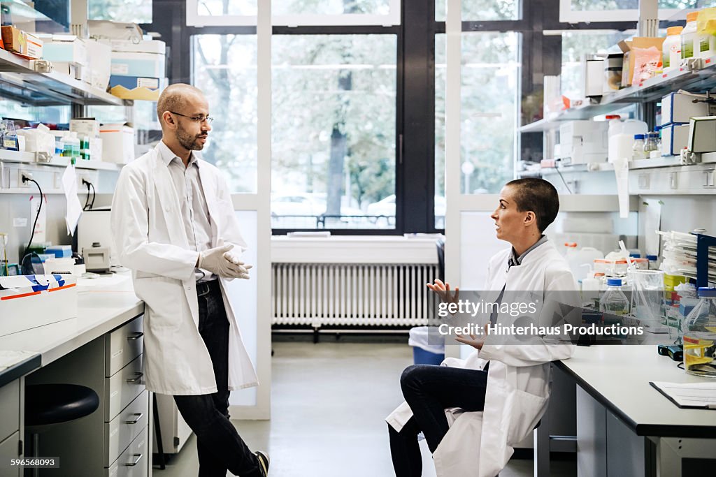Scientists In A Laboratory Talking To Each Other High-Res Stock Photo ... Scientists In A Laboratory Talking To Each Other High-Res Stock Photo ...