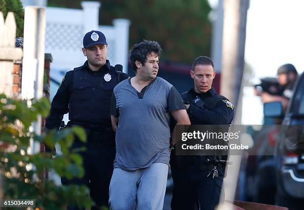Swat Team Members Lead A Man From A Home On Francis Street In Revere