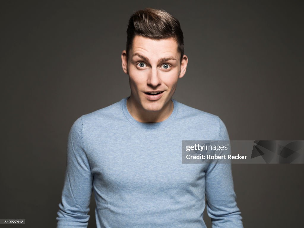 Happily Surprised Young Man High-Res Stock Photo - Getty Images Happily Surprised Young Man High-Res Stock Photo - Getty Images