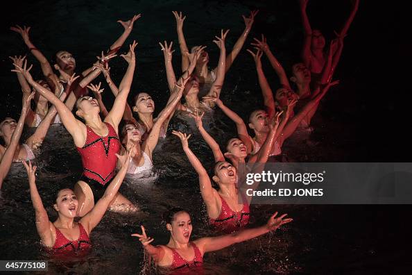 In a photo taken on February 15, 2017 swimmers perform in a... News ... In a photo taken on February 15, 2017 swimmers perform in a... News ...