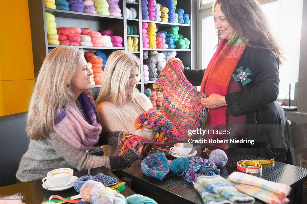 Knitting Teacher With Two Women In Knitting Lesson Shows Scarf Bavaria ... Knitting Teacher With Two Women In Knitting Lesson Shows Scarf Bavaria ...