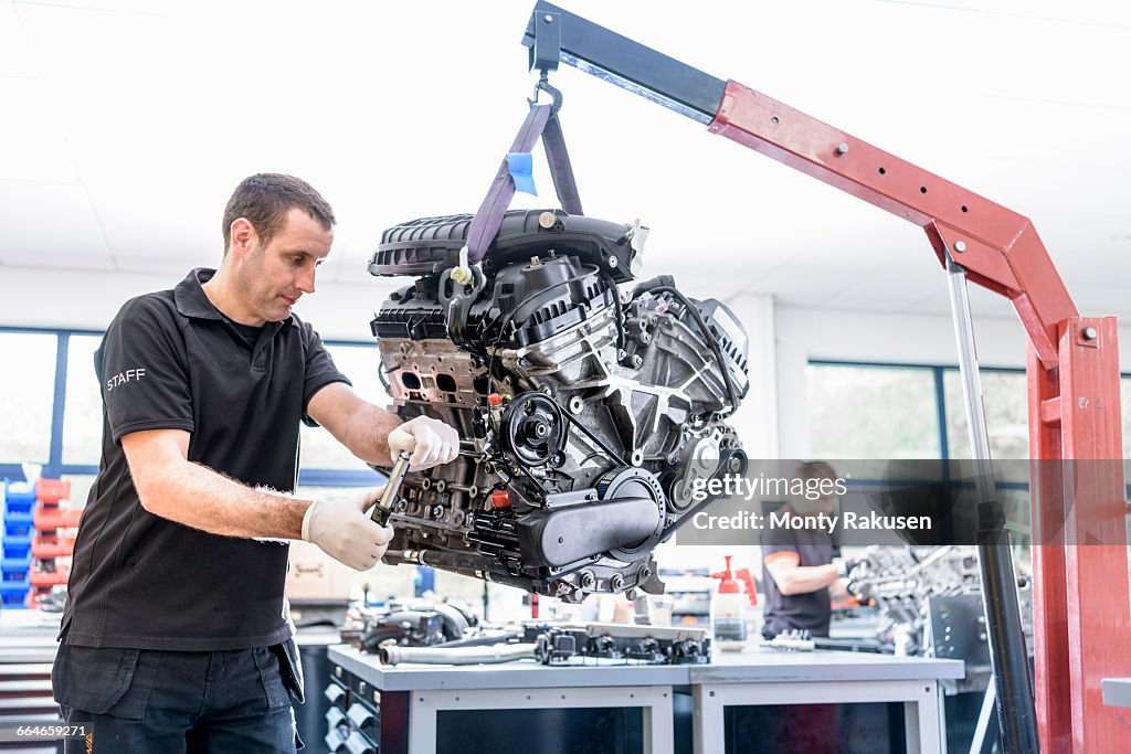 Engineers Working On Engines In Racing Car Factory High-Res Stock Photo ... Engineers Working On Engines In Racing Car Factory High-Res Stock Photo ...
