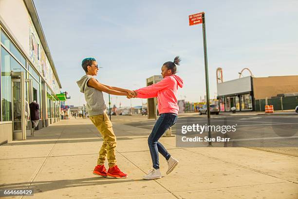 Two Girls Touching Each Other Photos And Premium High Res Pictures