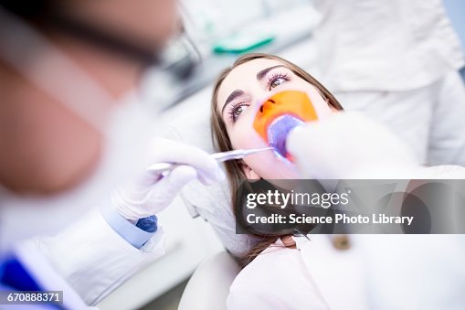 Dentist Using Ultraviolet Light High-Res Stock Photo - Getty Images Dentist Using Ultraviolet Light High-Res Stock Photo - Getty Images