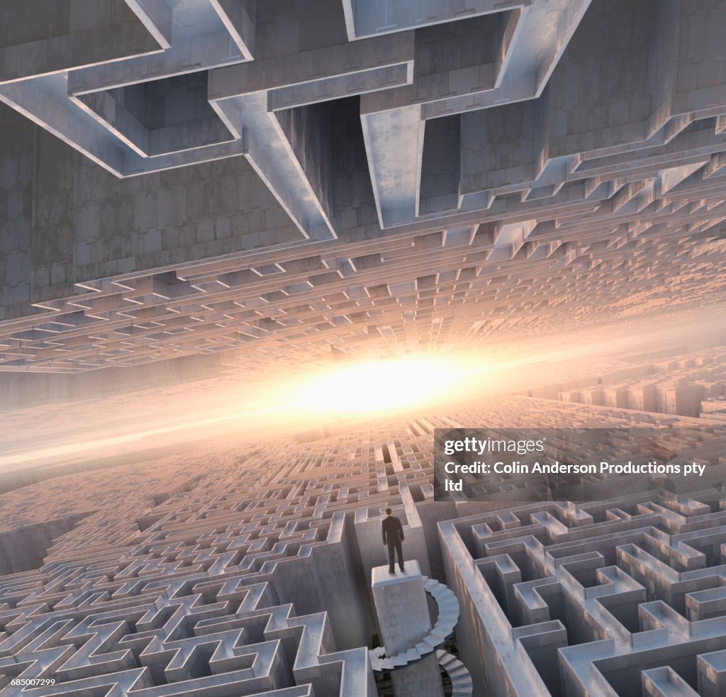 Mixed Race Businessman Watching Sunset Between Mazes Stock-Foto - Getty ... Mixed Race Businessman Watching Sunset Between Mazes Stock-Foto - Getty ...