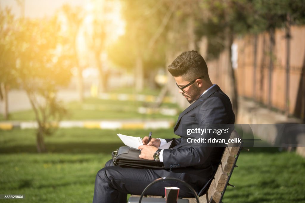 Businessman Write Notebook High-Res Stock Photo - Getty Images Businessman Write Notebook High-Res Stock Photo - Getty Images