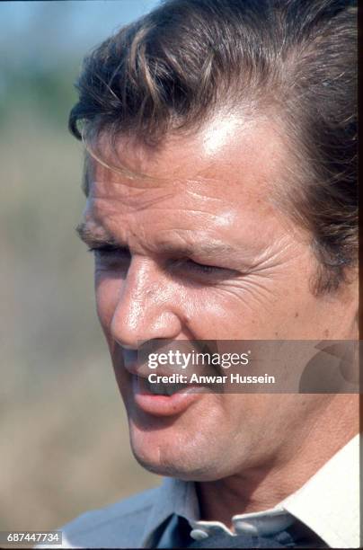 Roger Moore Anwar Hussein Photos And Premium High Res Pictures Getty Images