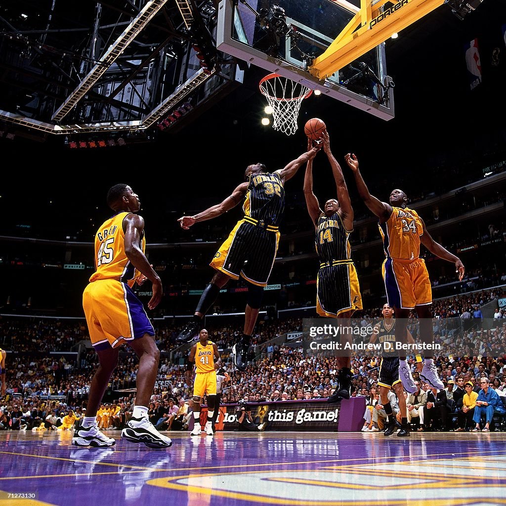 Dale Davis And Sam Perkins Of The Indiana Pacers Battle For A Rebound