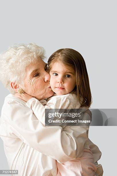 Grandmother Granddaughter Kiss Photos And Premium High Res Pictures