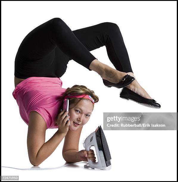 Contortionist Phone Photos And Premium High Res Pictures Getty Images