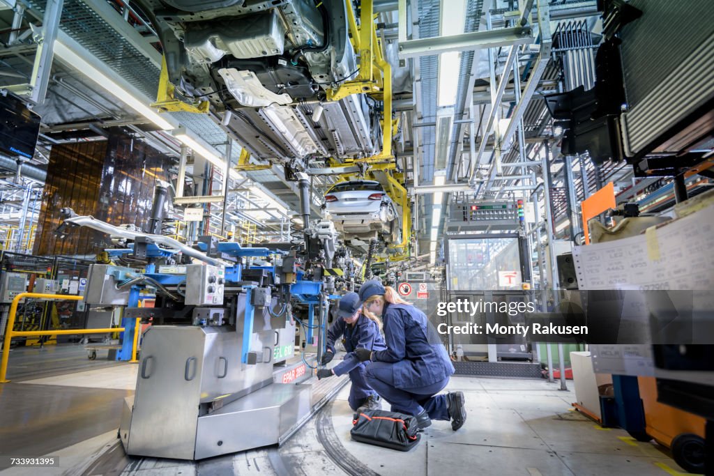 Female Maintenance Engineers Working On Production Line In Car Factory ... Female Maintenance Engineers Working On Production Line In Car Factory ...