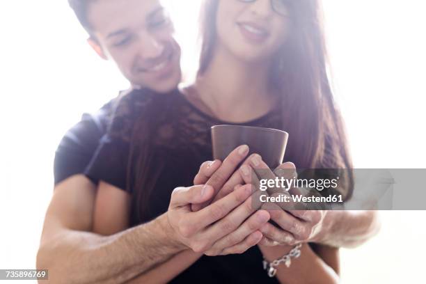373 Smiling Couple Holding Hands And Drinking Coffee In Cafe Stock