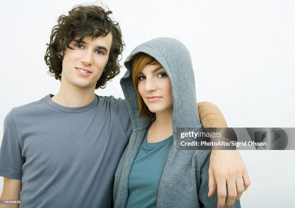 Young Couple Man With Arm Around Womans Shoulders Portrait High Res