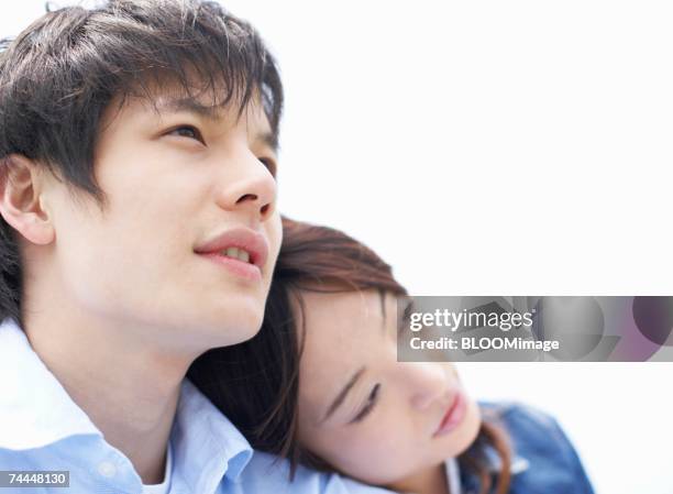 Japanese Couple Sitting On Meadow Photos Et Images De Collection