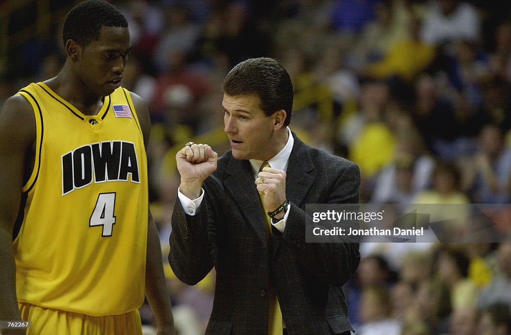 Head Coach Steve Alford of the Iowa Hawkeyes talks to forward Glen ... Head Coach Steve Alford of the Iowa Hawkeyes talks to forward Glen ...