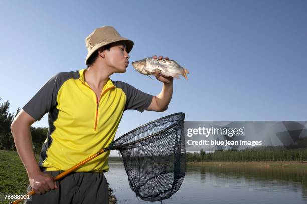 Man Kissing Fish Photos and Premium High Res Pictures - Getty Images Man Kissing Fish Photos and Premium High Res Pictures - Getty Images