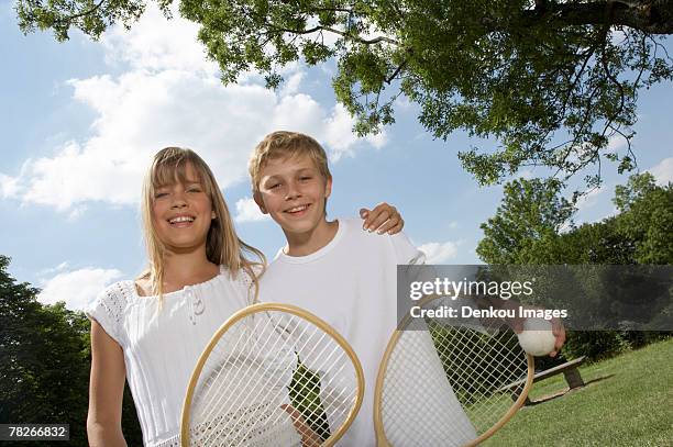 Girl Holding A Tennis Racket And Two Balls Photos And Premium High Res