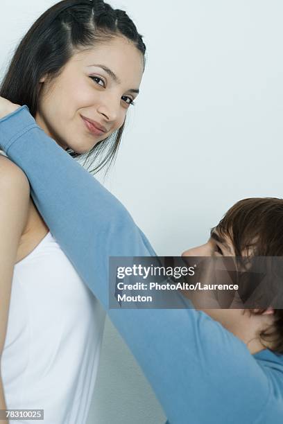 Putting Arms Around Shoulders Photos And Premium High Res Pictures