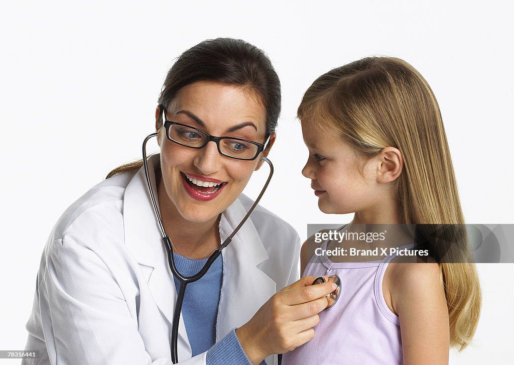 Doctor Listening To Heart With Stethoscope High-Res Stock Photo - Getty ... Doctor Listening To Heart With Stethoscope High-Res Stock Photo - Getty ...