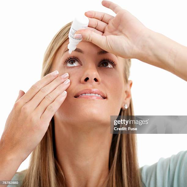 Using Eye Drops Photos And Premium High Res Pictures Getty Images