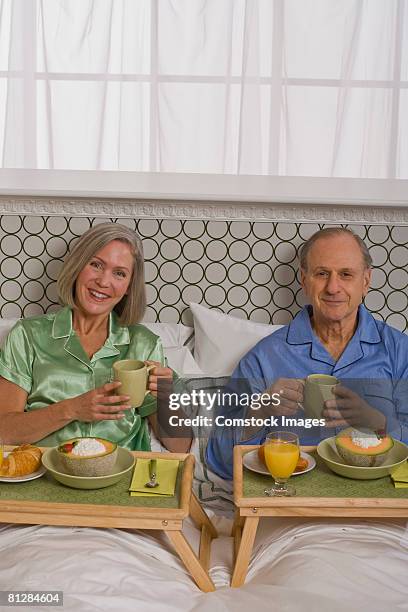 Woman And Man In Bed Facing Camera Sitting Up Photos And Premium High