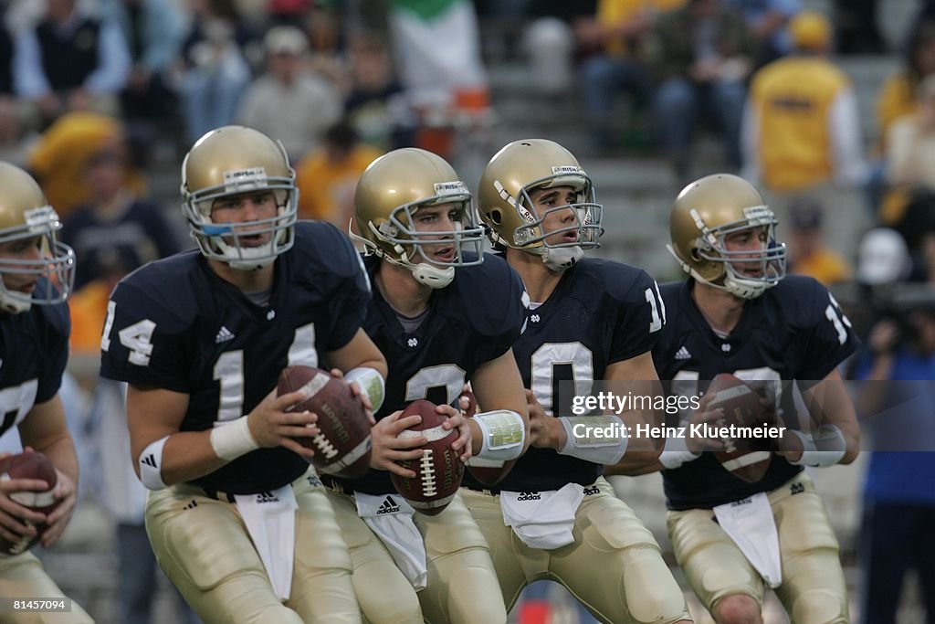 Notre Dame QB Brady Quinn warming up with backup quarterbacks before ... Notre Dame QB Brady Quinn warming up with backup quarterbacks before ...